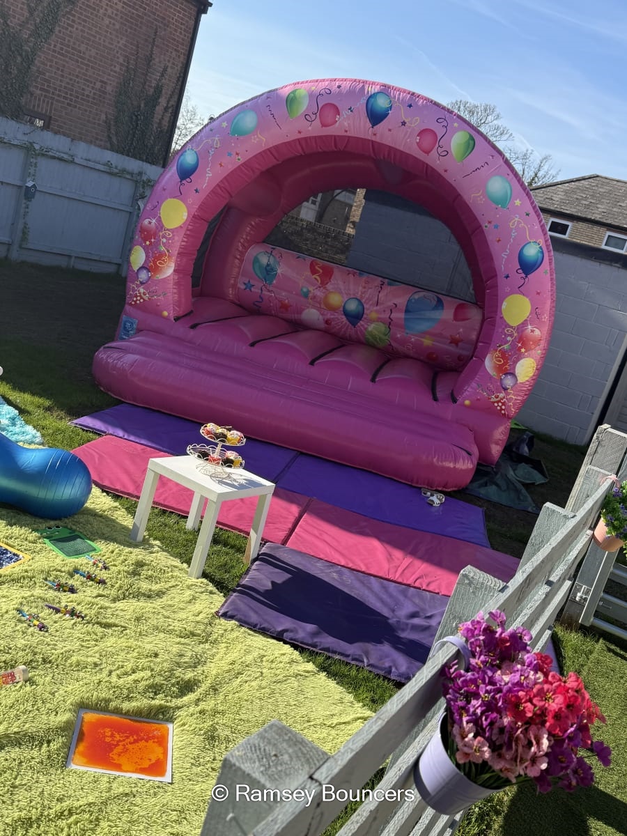Pink curved castle - Bouncy Castle Hire in Ramsey | Ramsey Bouncers
